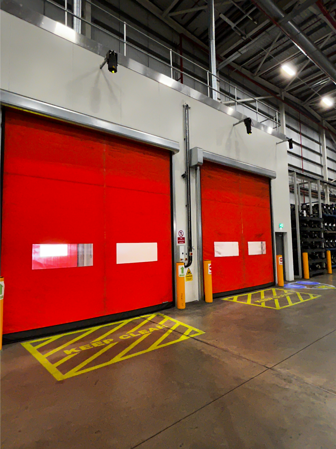 Projected safety signage is critical for warehouse automation.